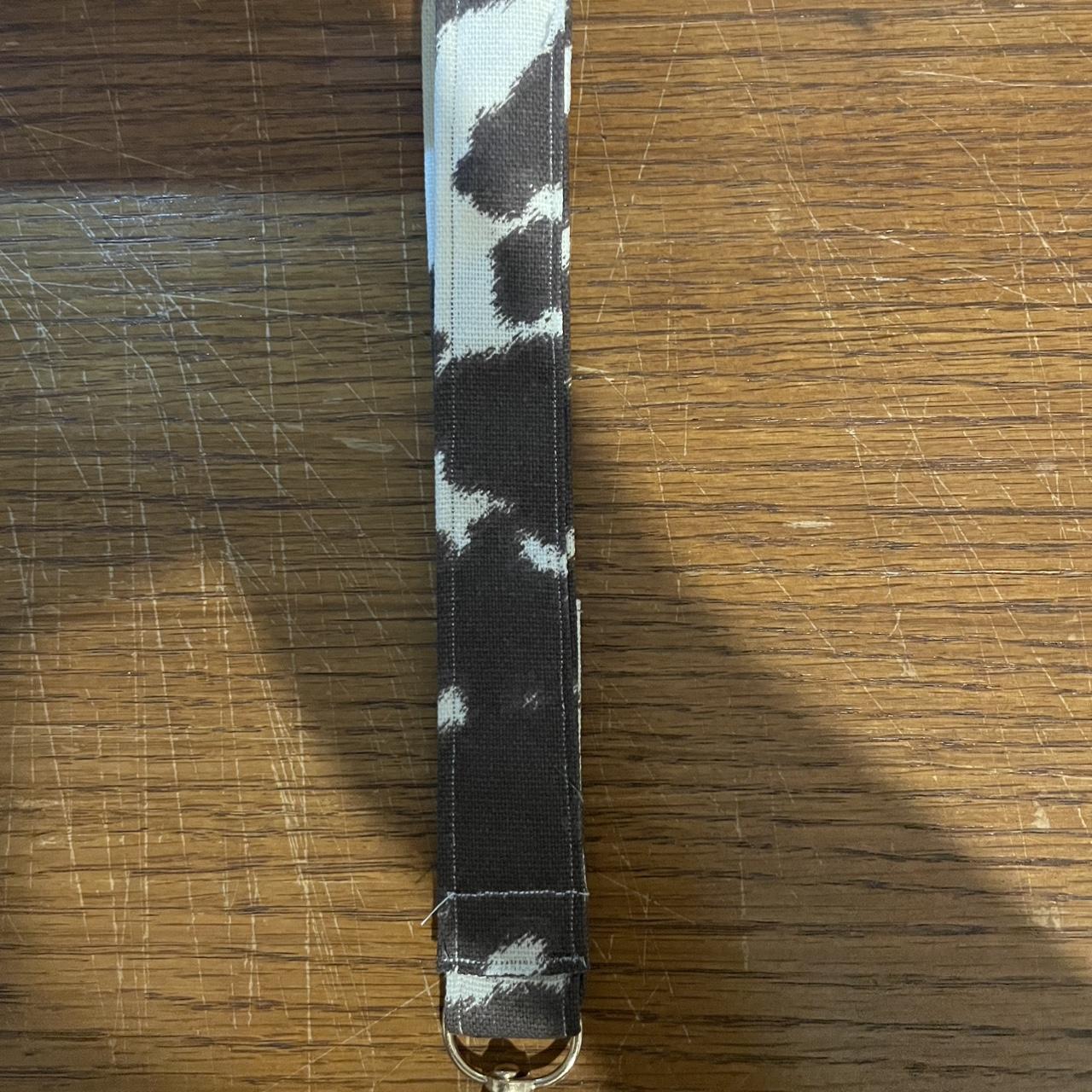 Adorable brown cow print keychain wristlets.... | Depop