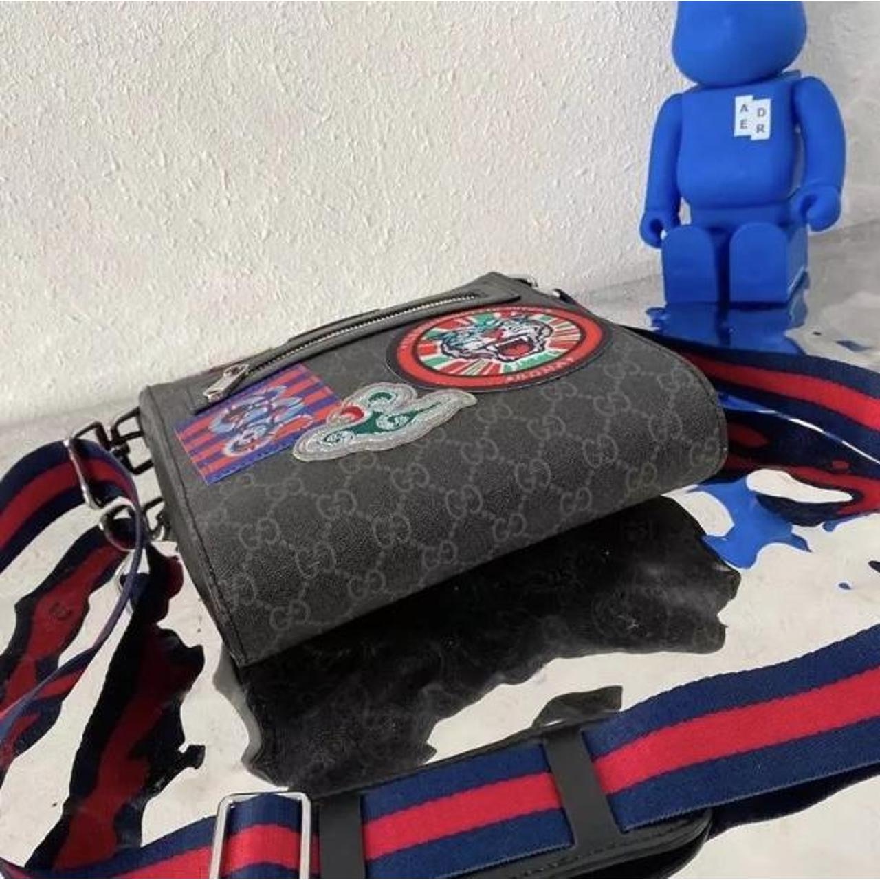 gucci mens bag lion badge shipping will take 2-3... - Depop