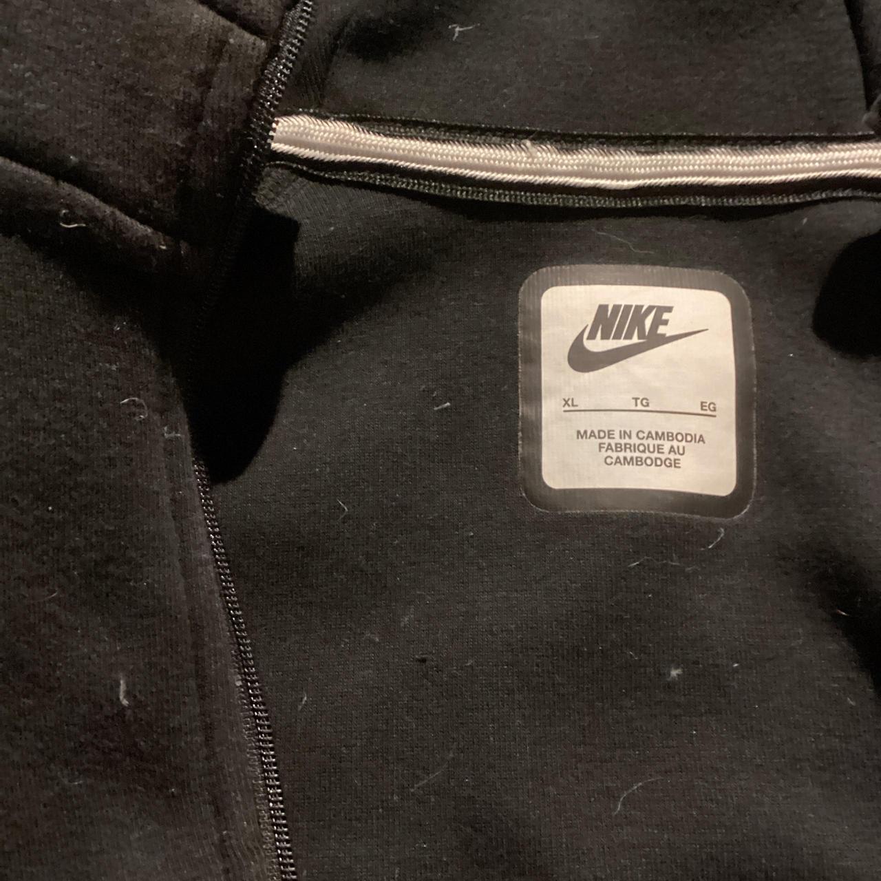 small black Nike tech worn a little bit has a couple... | Depop
