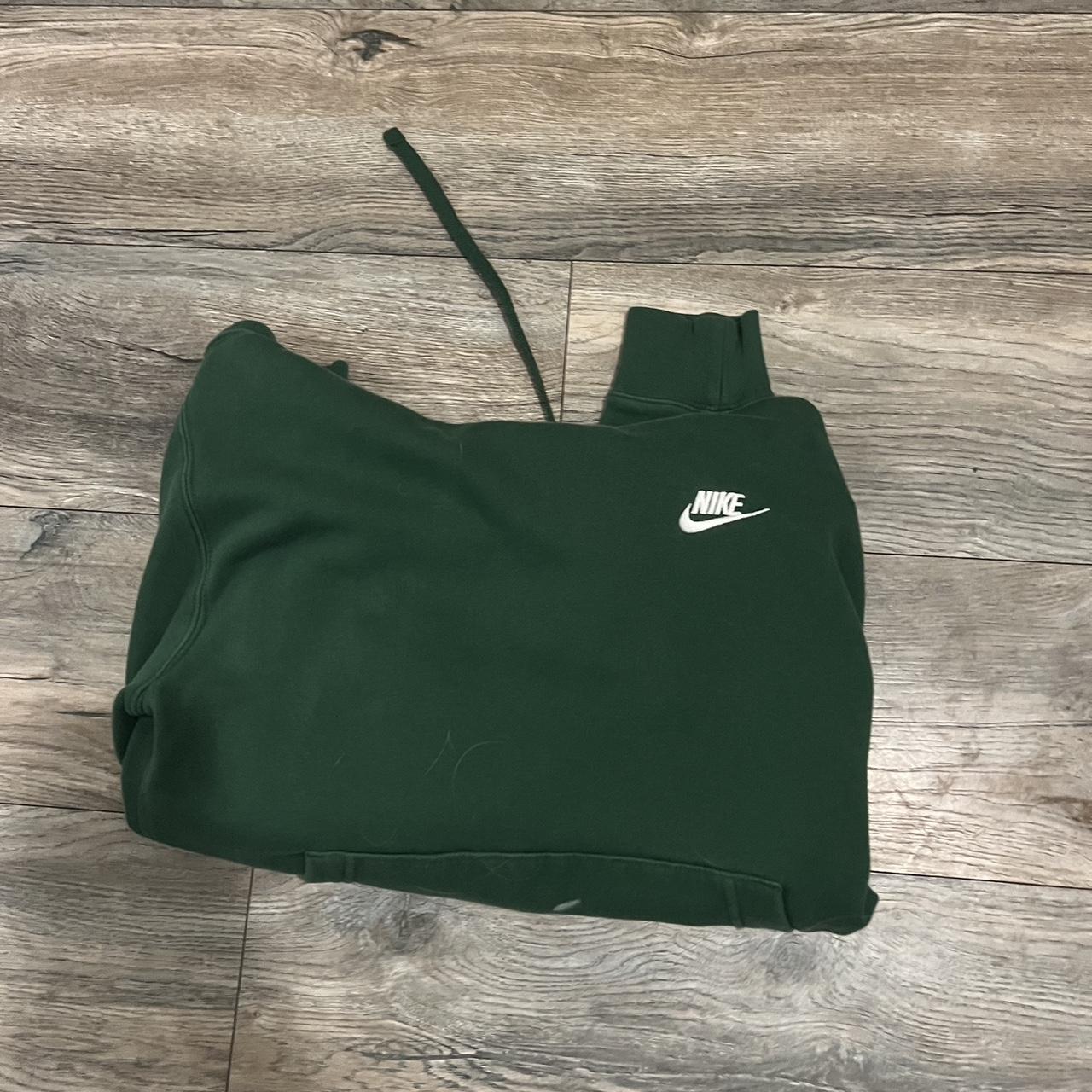 dark green nike hoodie with small paint stain worn... - Depop