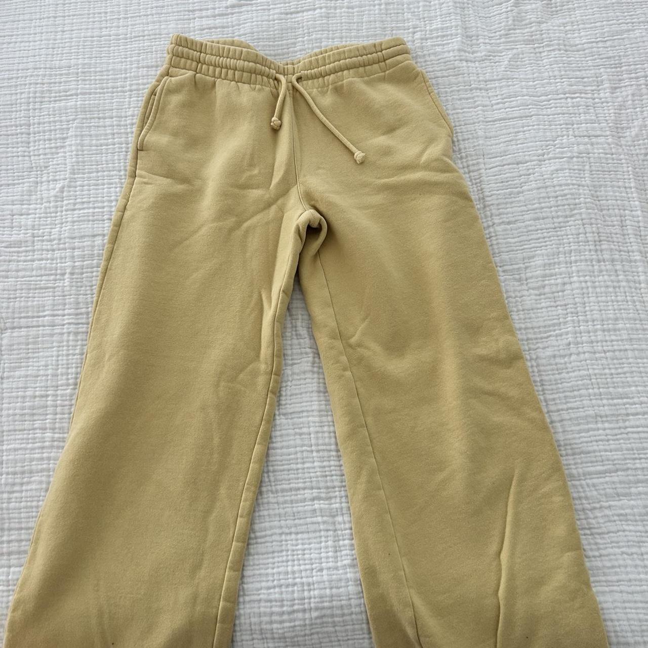 yellow Aritzia TNA sweatpants. Love the color and... - Depop