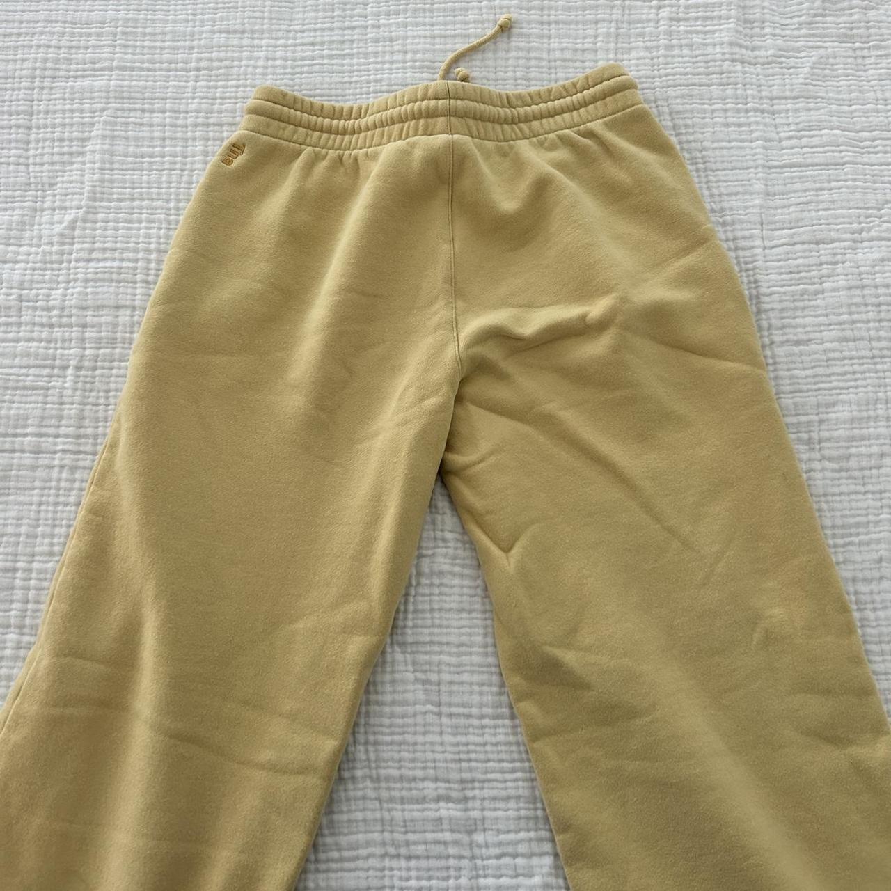 yellow Aritzia TNA sweatpants. Love the color and... - Depop