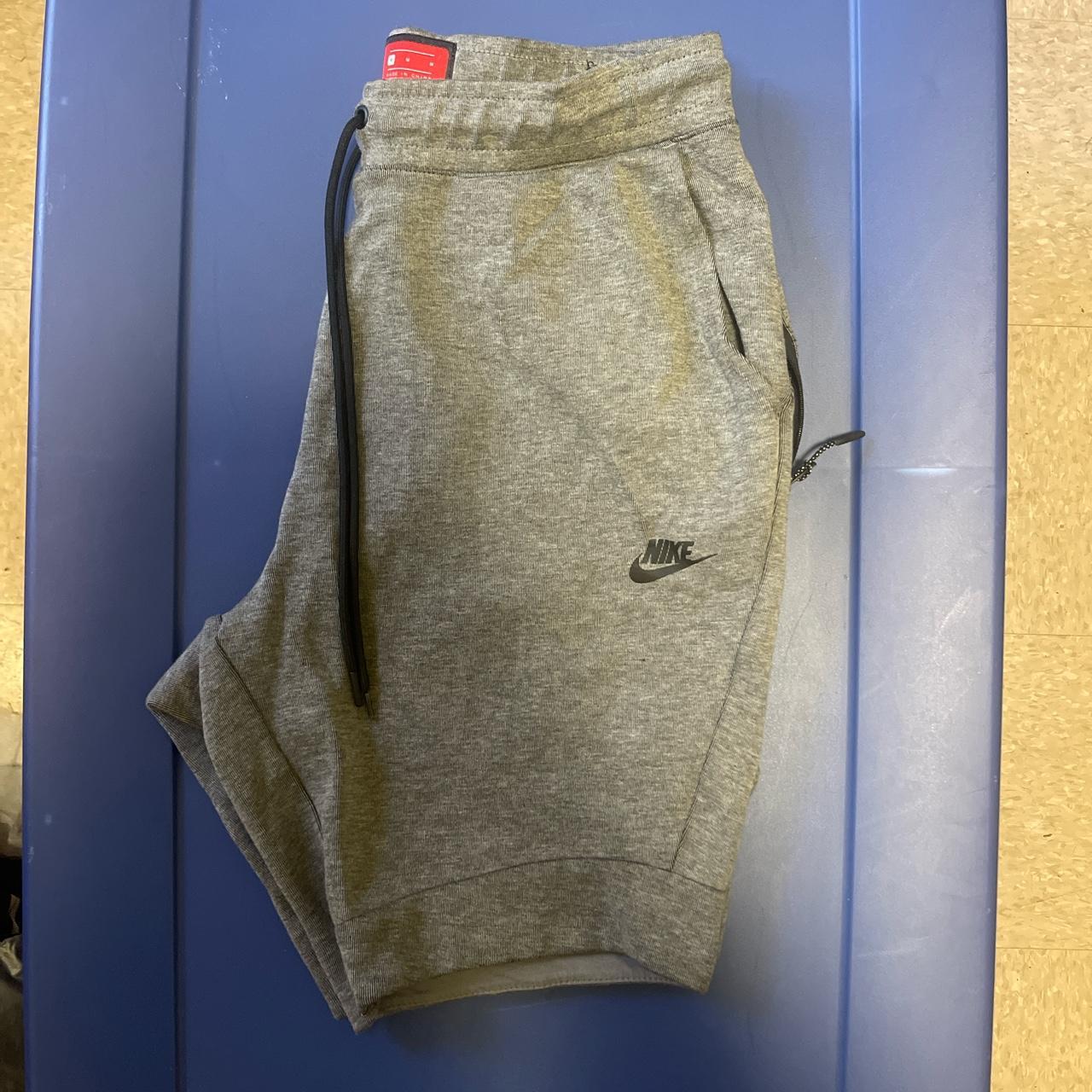 NIKE TECH SHORTS GREY SIZE MEDIUM MINOR RIP,... - Depop