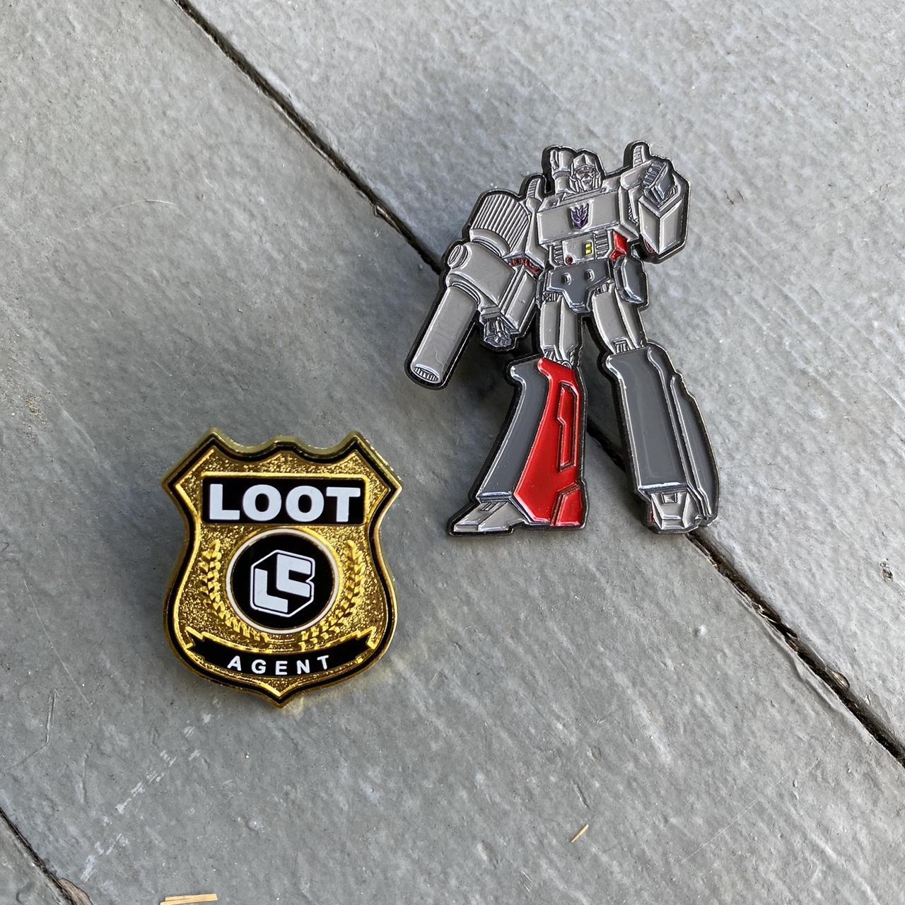 Transformer and loot agent pins never been used - Depop