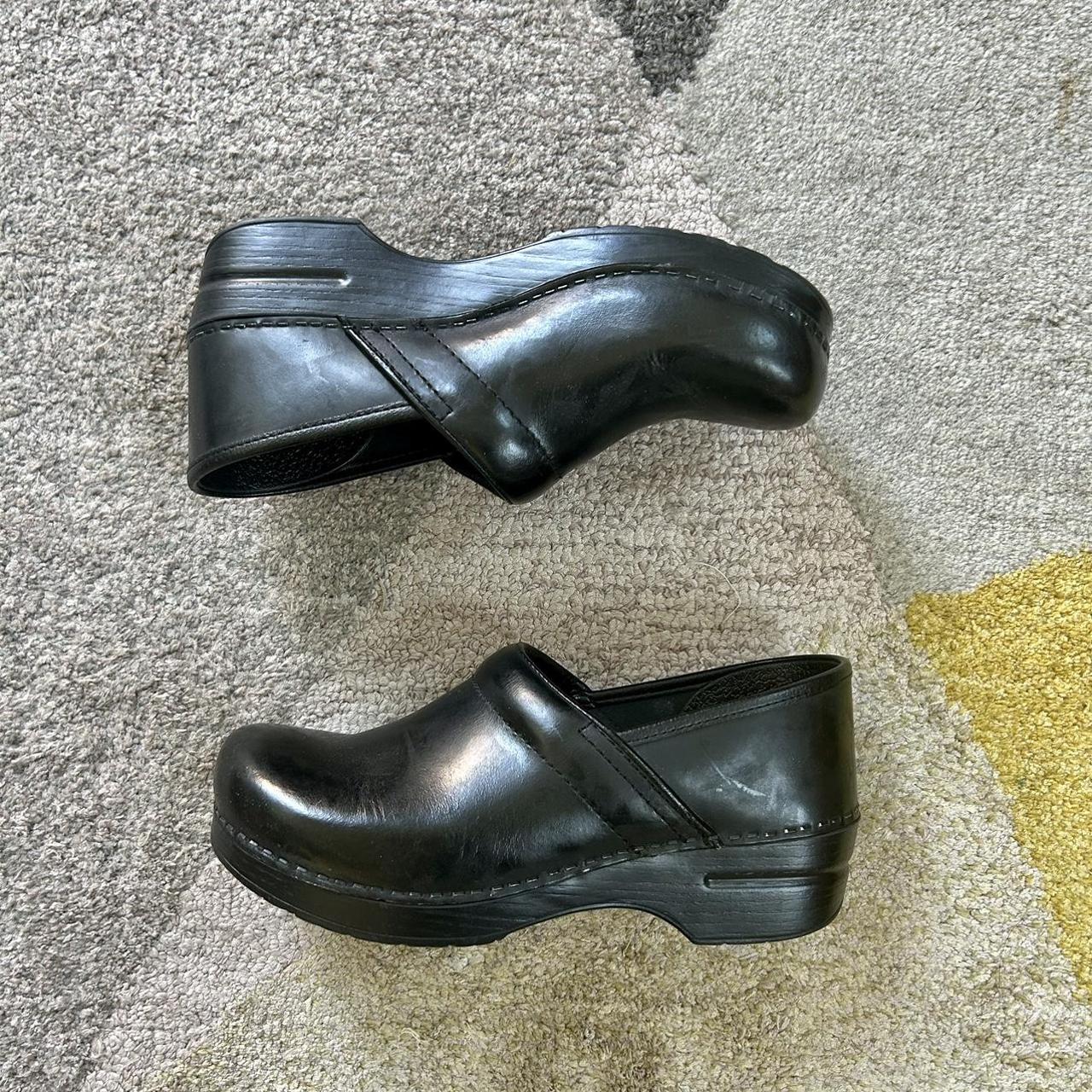 Dansko Women's Black Clogs | Depop
