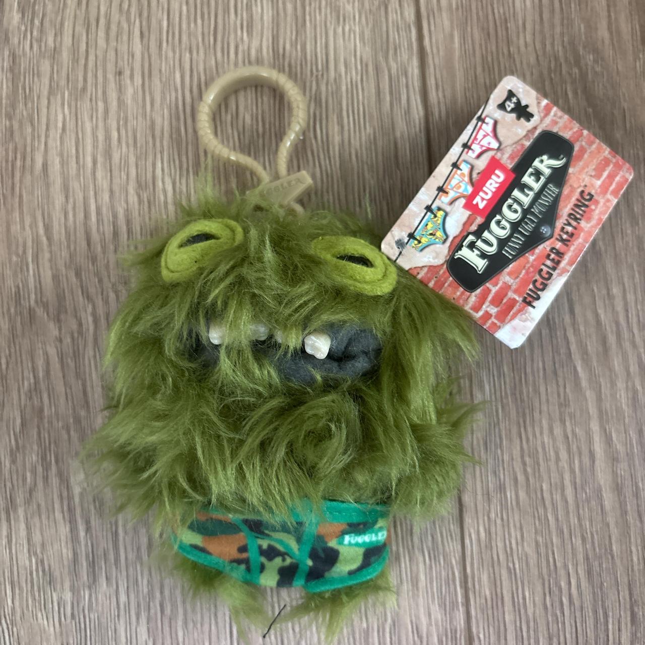 Green and khaki Fuggler Monster plush keychain... | Depop