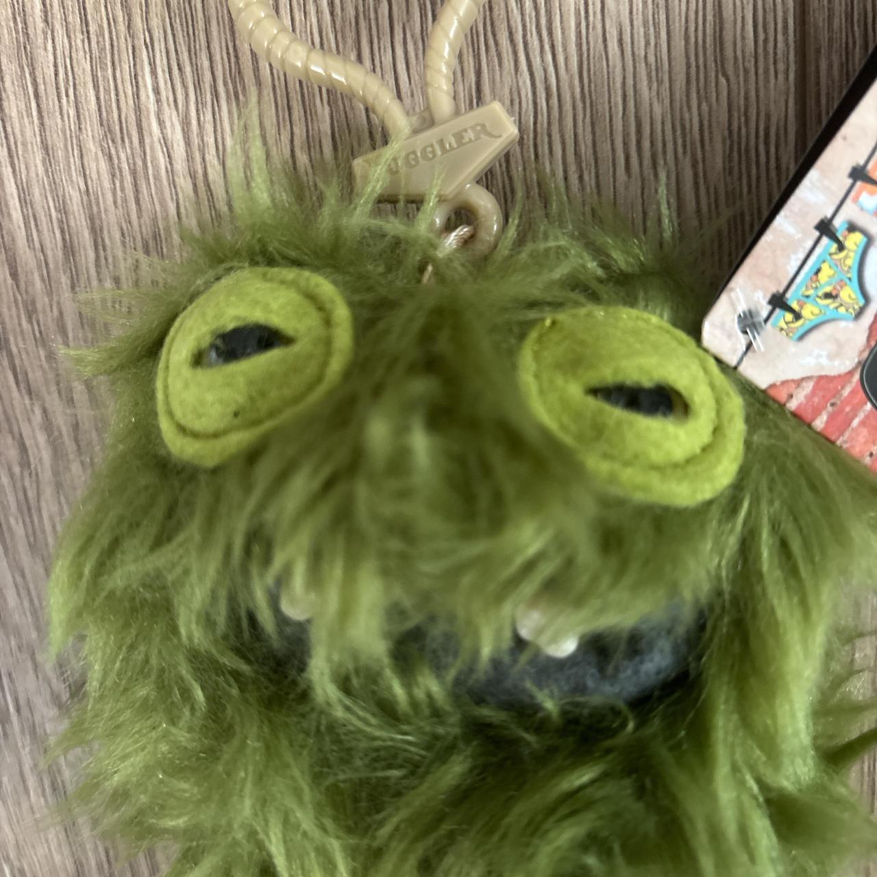 Green and khaki Fuggler Monster plush keychain... | Depop