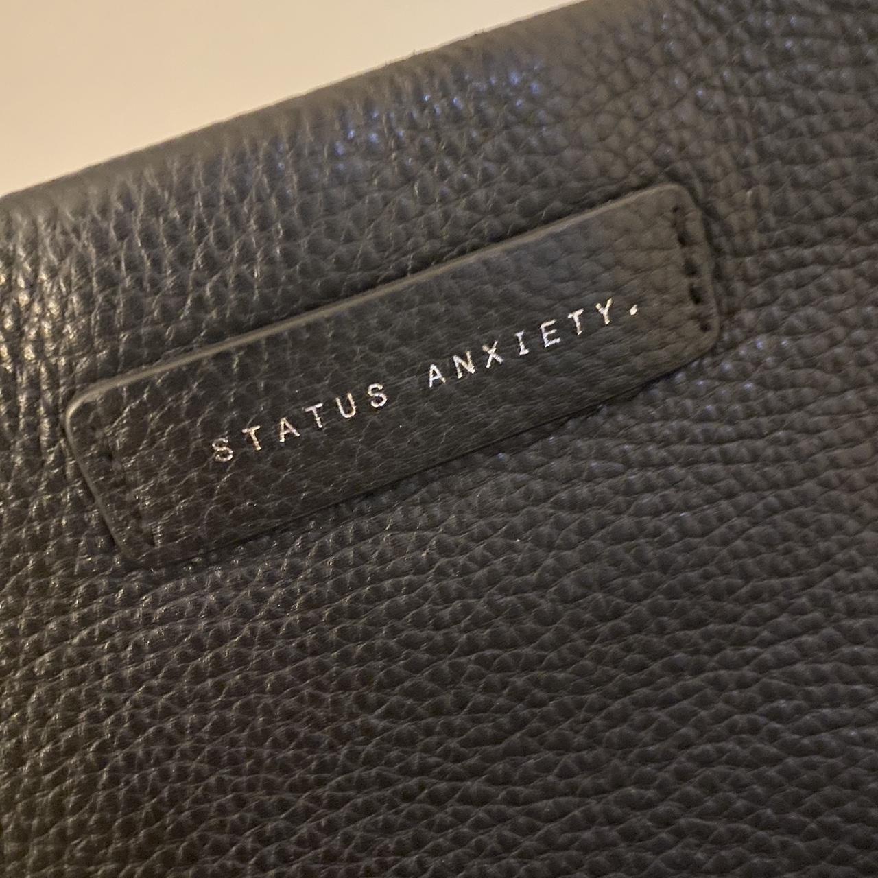 Status Anxiety small black leather hand bag. In... - Depop