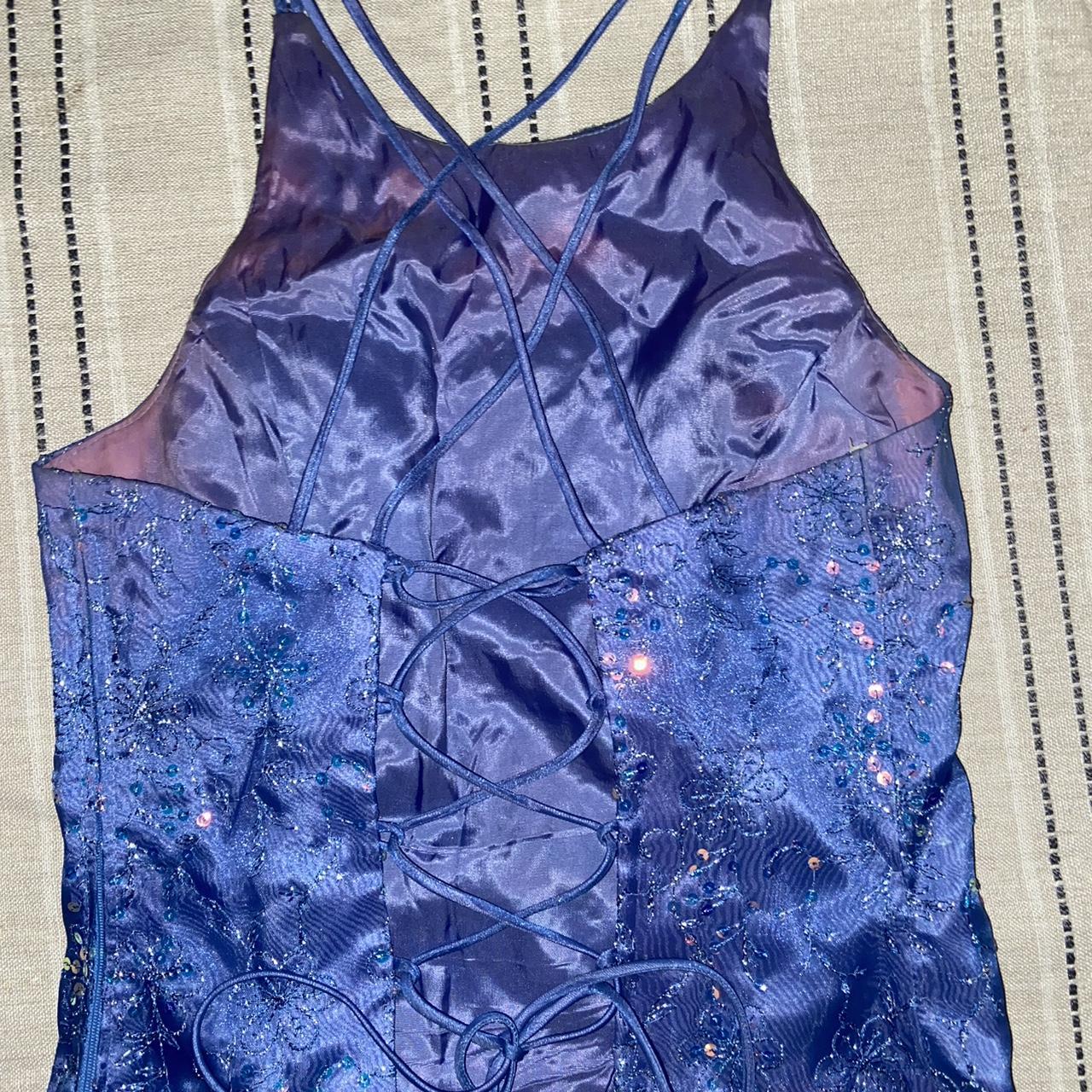 A purple sparkly corset with boning in ties up in... - Depop