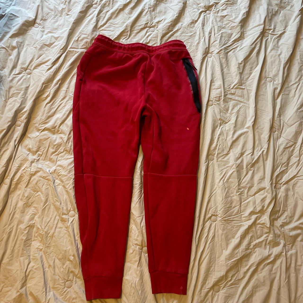 red nike tech pants men medium small bleach stain on... - Depop