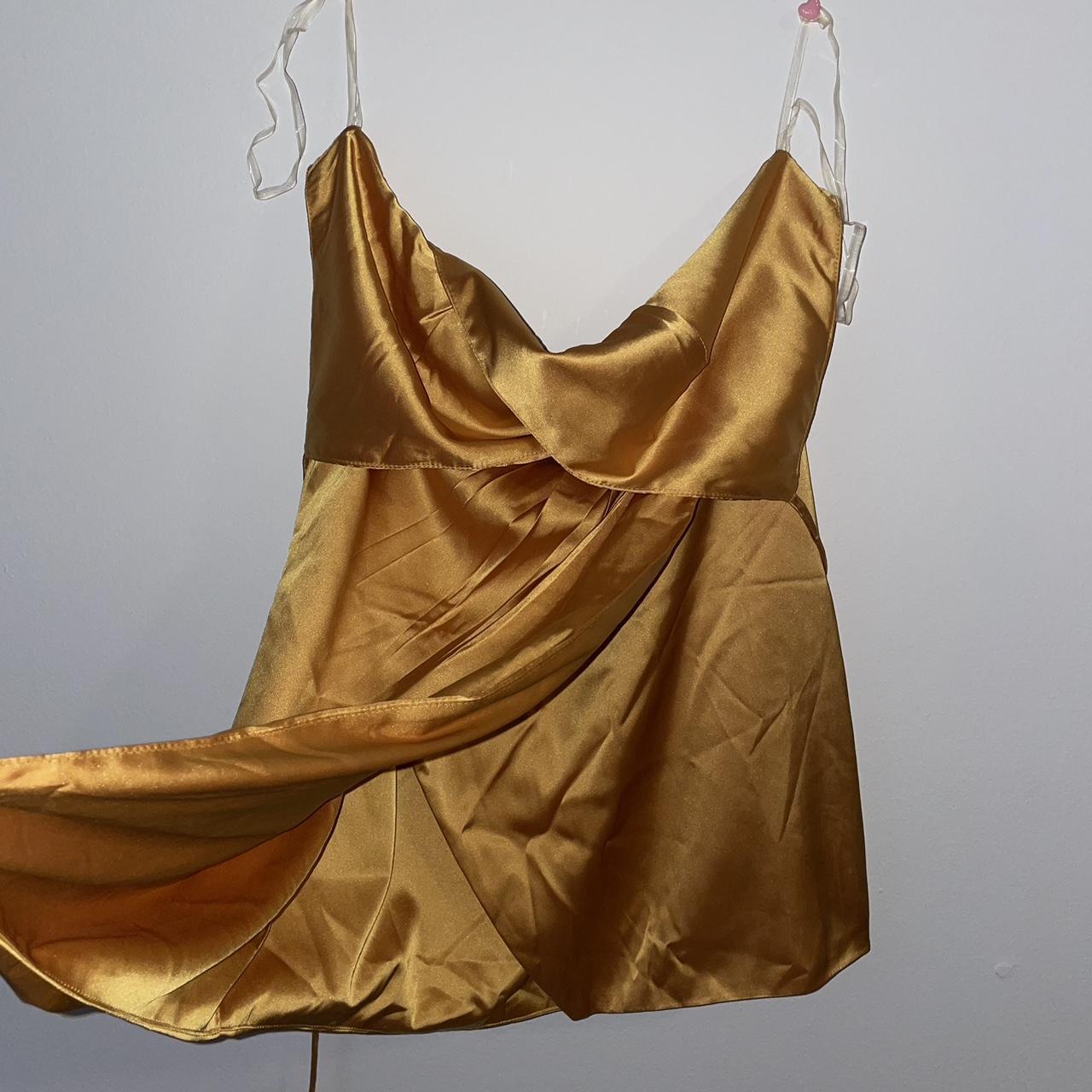Gold satin mini dress with a flowy, asymmetrical... - Depop