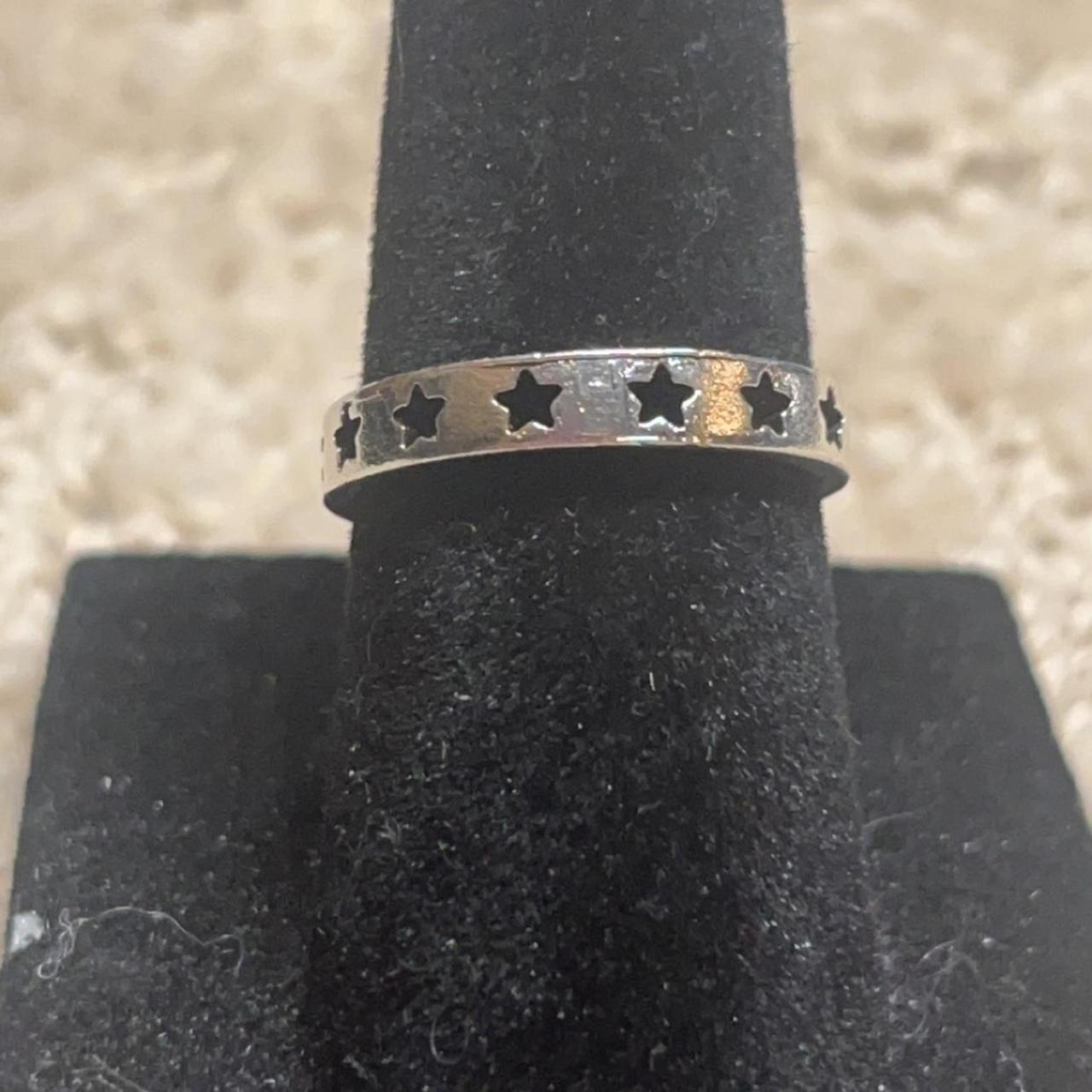Sterling silver star ring with a touch of grey... - Depop