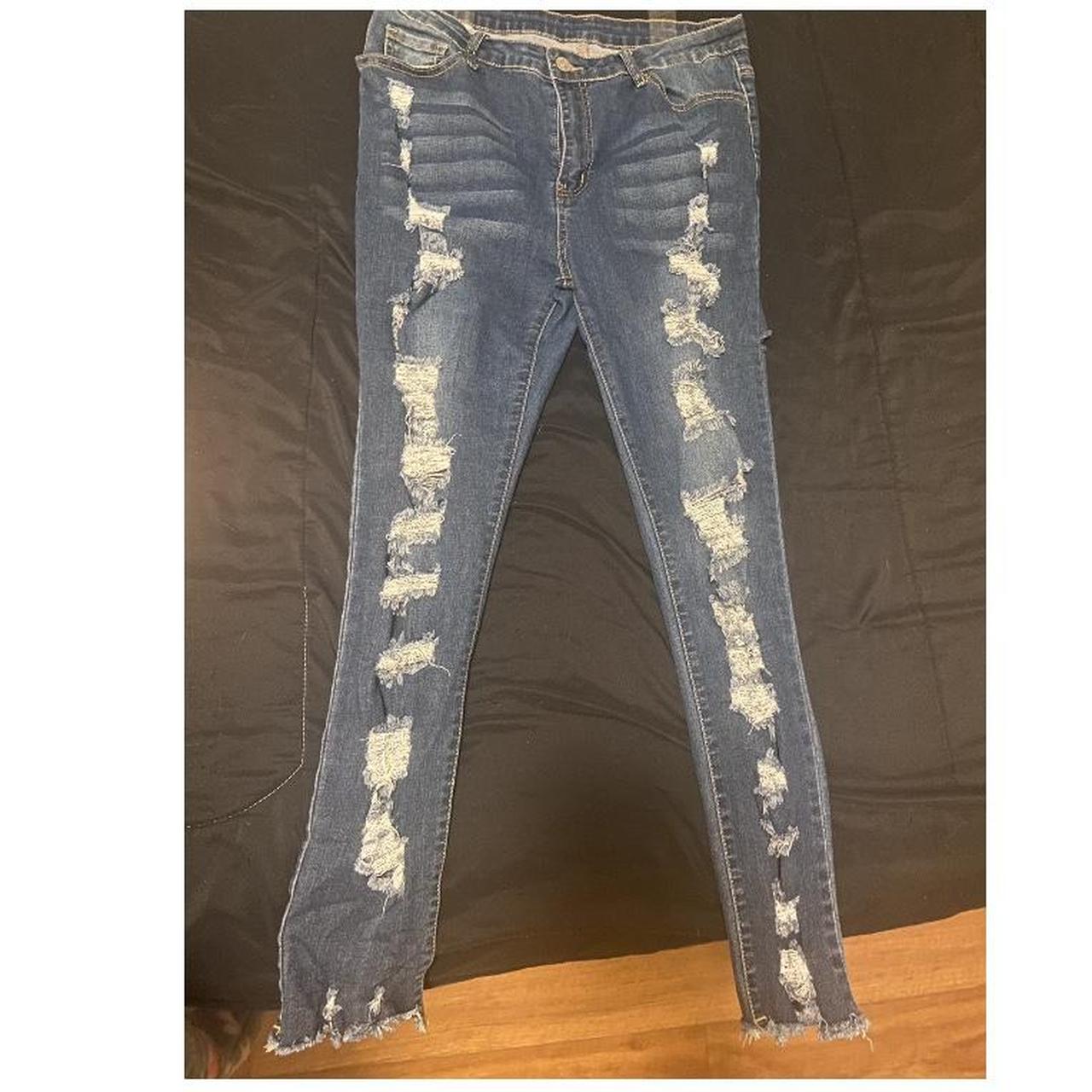 Ripped dark blue jeans. Ripped on the front and back... - Depop