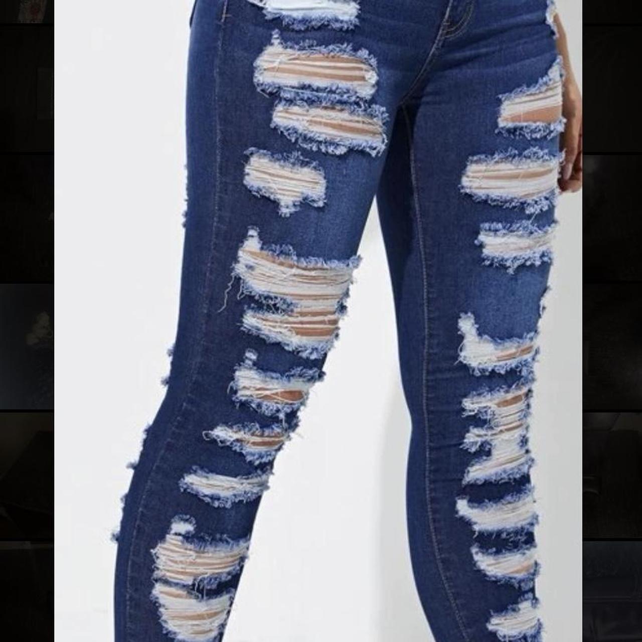 Ripped dark blue jeans. Ripped on the front and back... - Depop