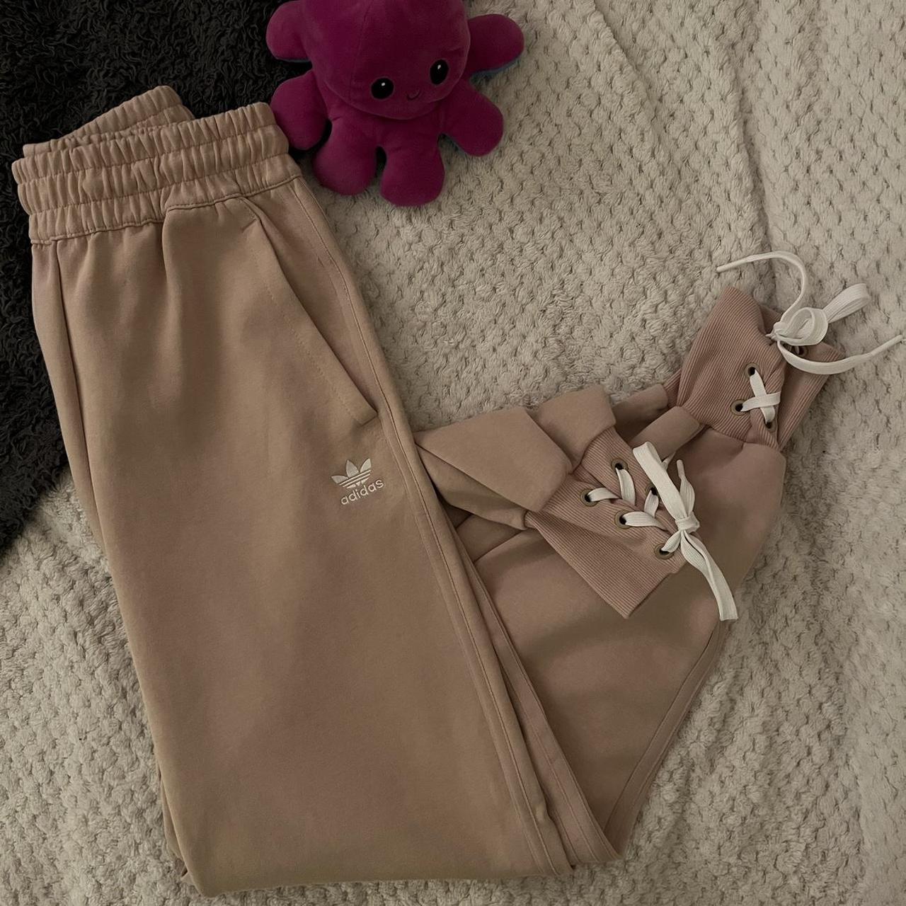 Small Adidas tan sweatpants hemmed with laces Never... - Depop