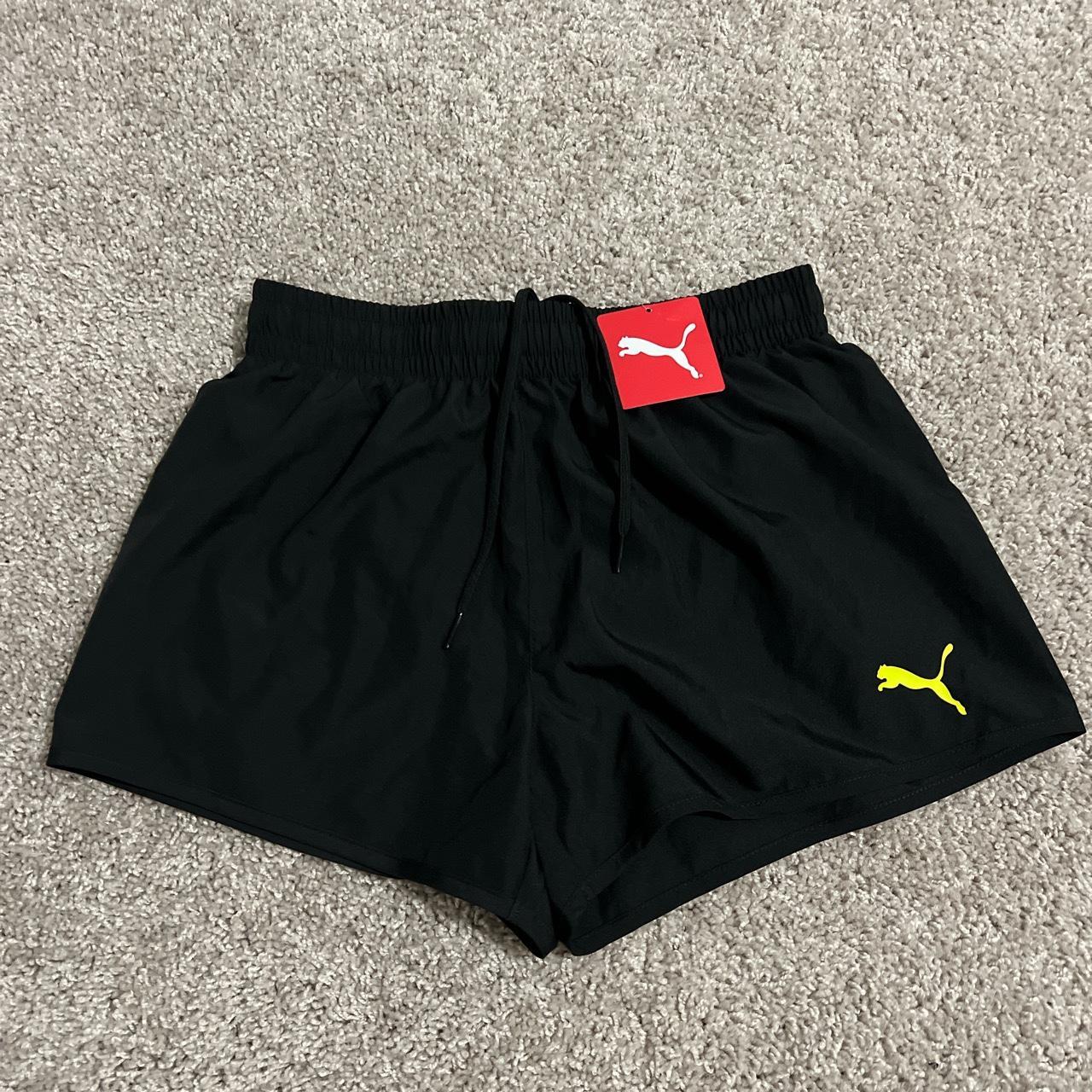 Puma Women's Black and Yellow Shorts | Depop