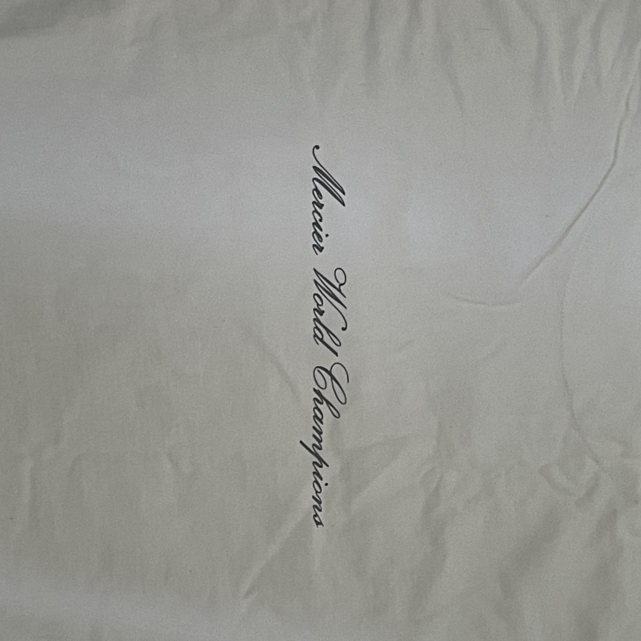 White Mercier t-shirt with world champions graphic... - Depop