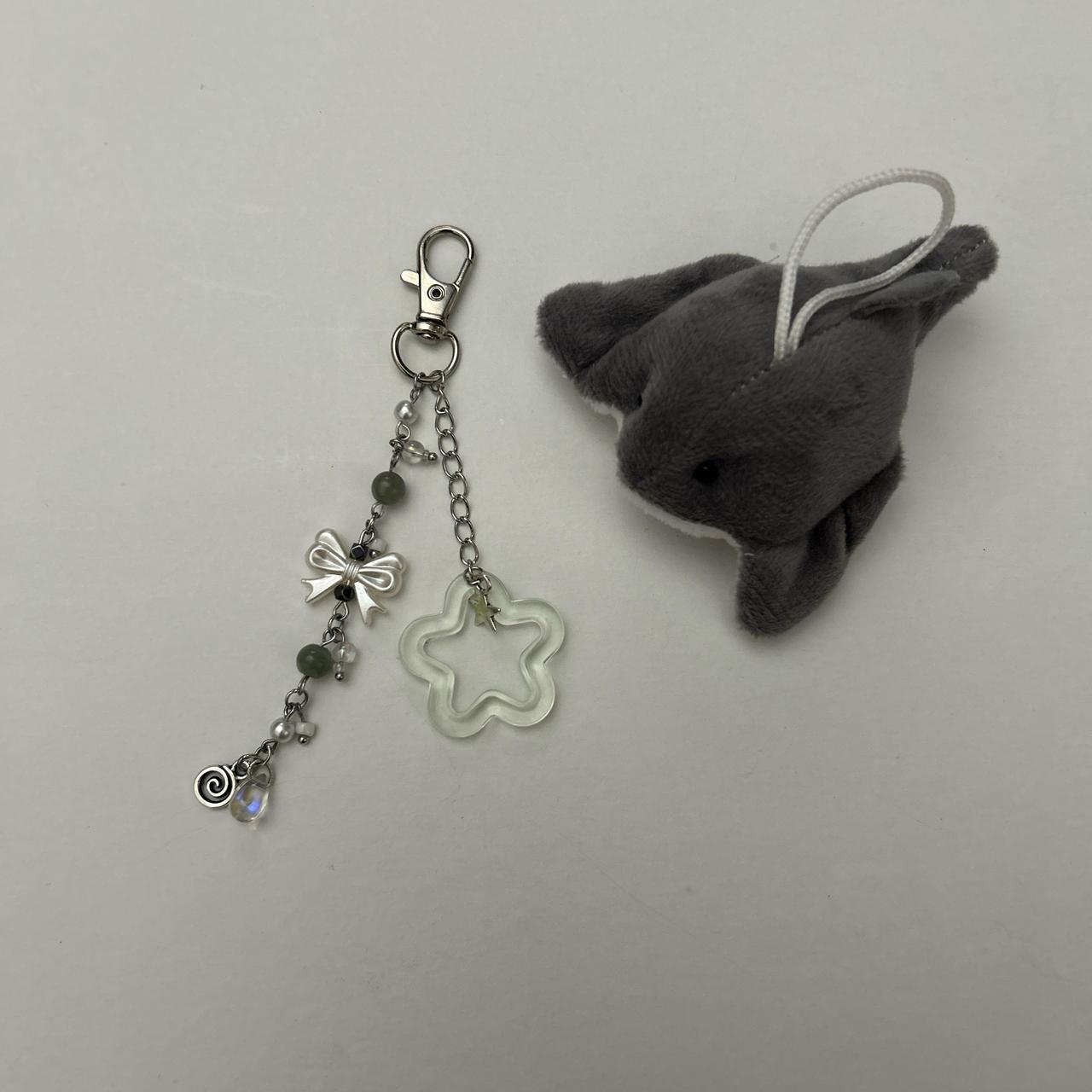 a stingray plush keychain with matching bead... - Depop