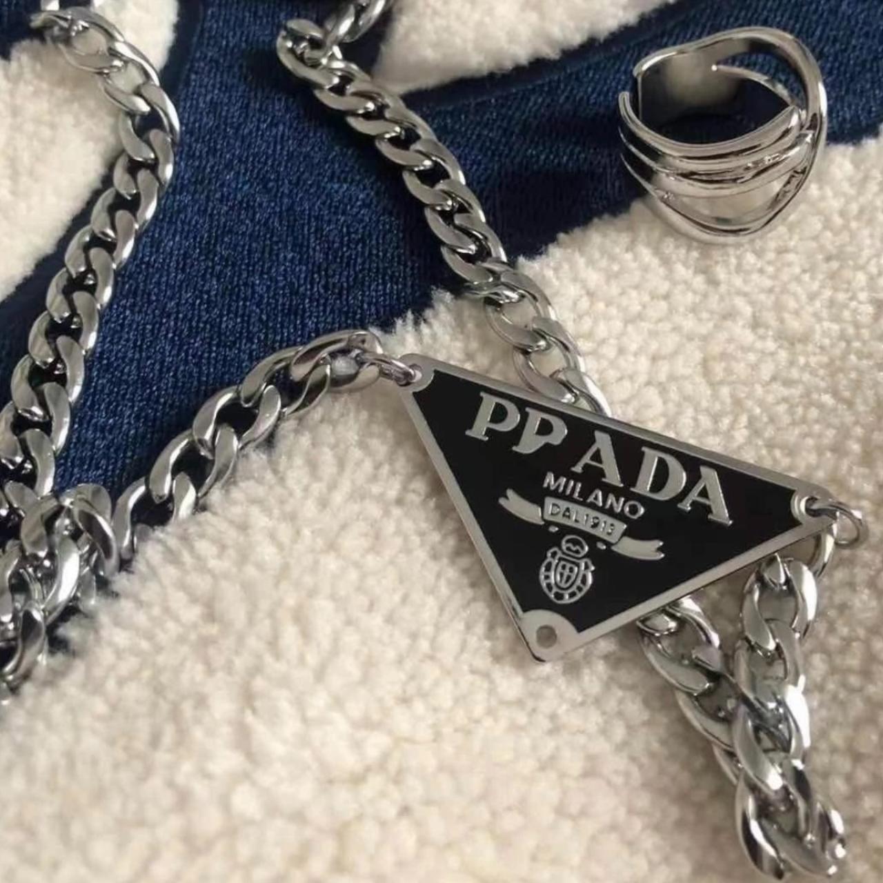 Black Prada trangle logo tag repurposed into custom... - Depop