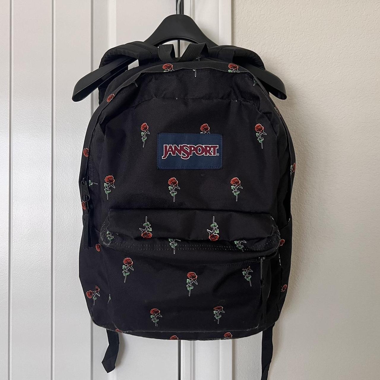 Jansport black with red roses pattern... - Depop
