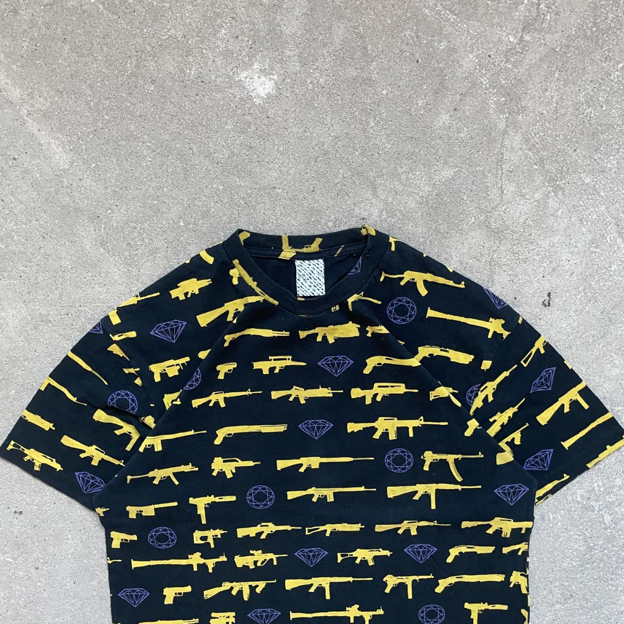 vintage 00s Y2K Rogue status all over print gun show... | Depop