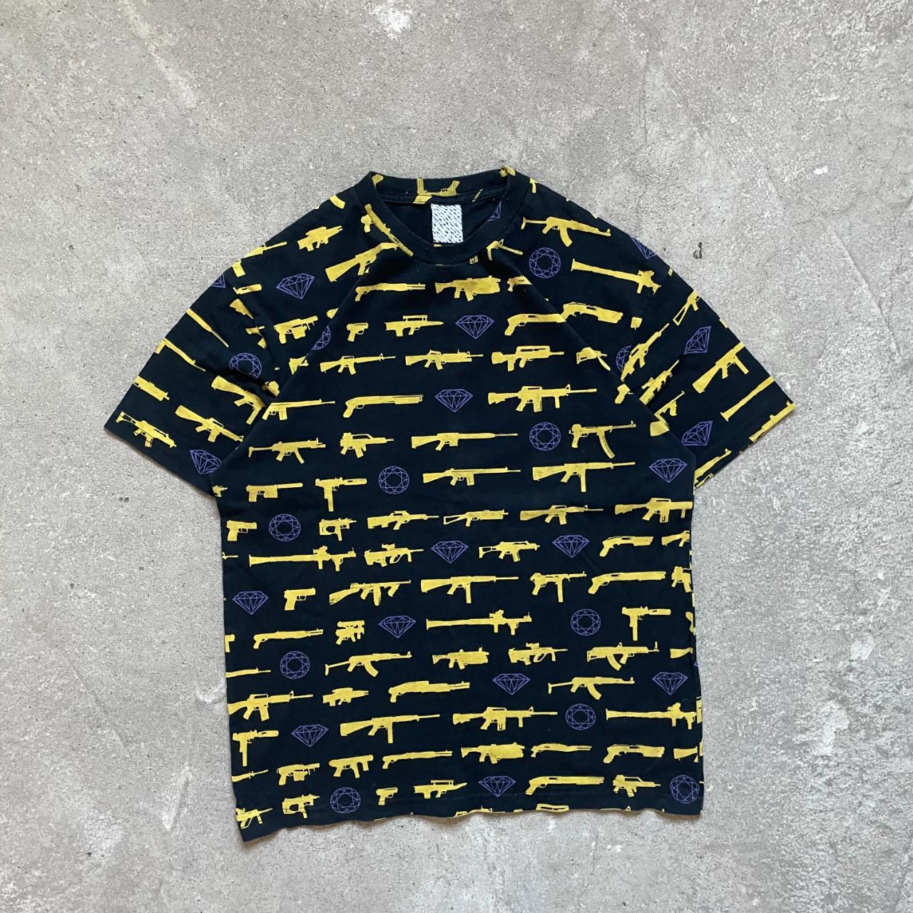 vintage 00s Y2K Rogue status all over print gun show... | Depop