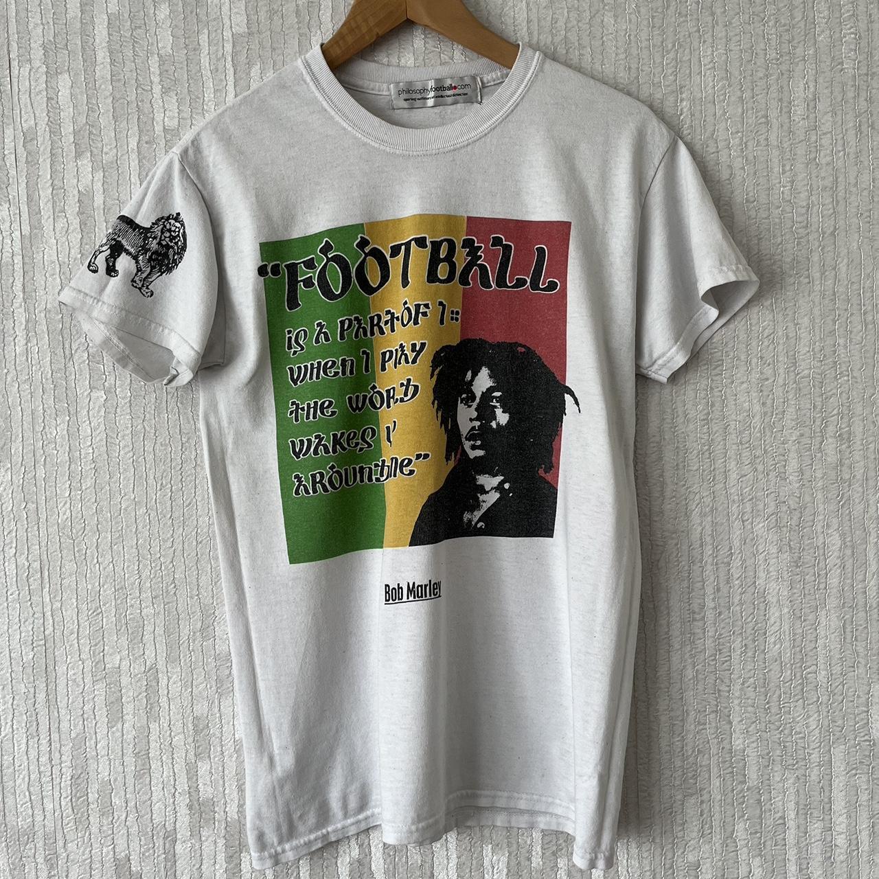 Bob Marley football t shirt Size small Tiny hole in... - Depop