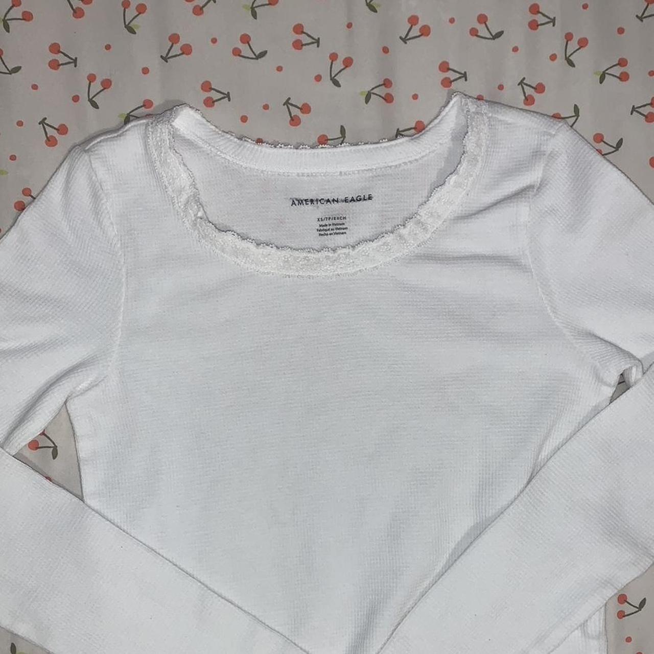 American Eagle white cropped long sleeve with a lace... - Depop