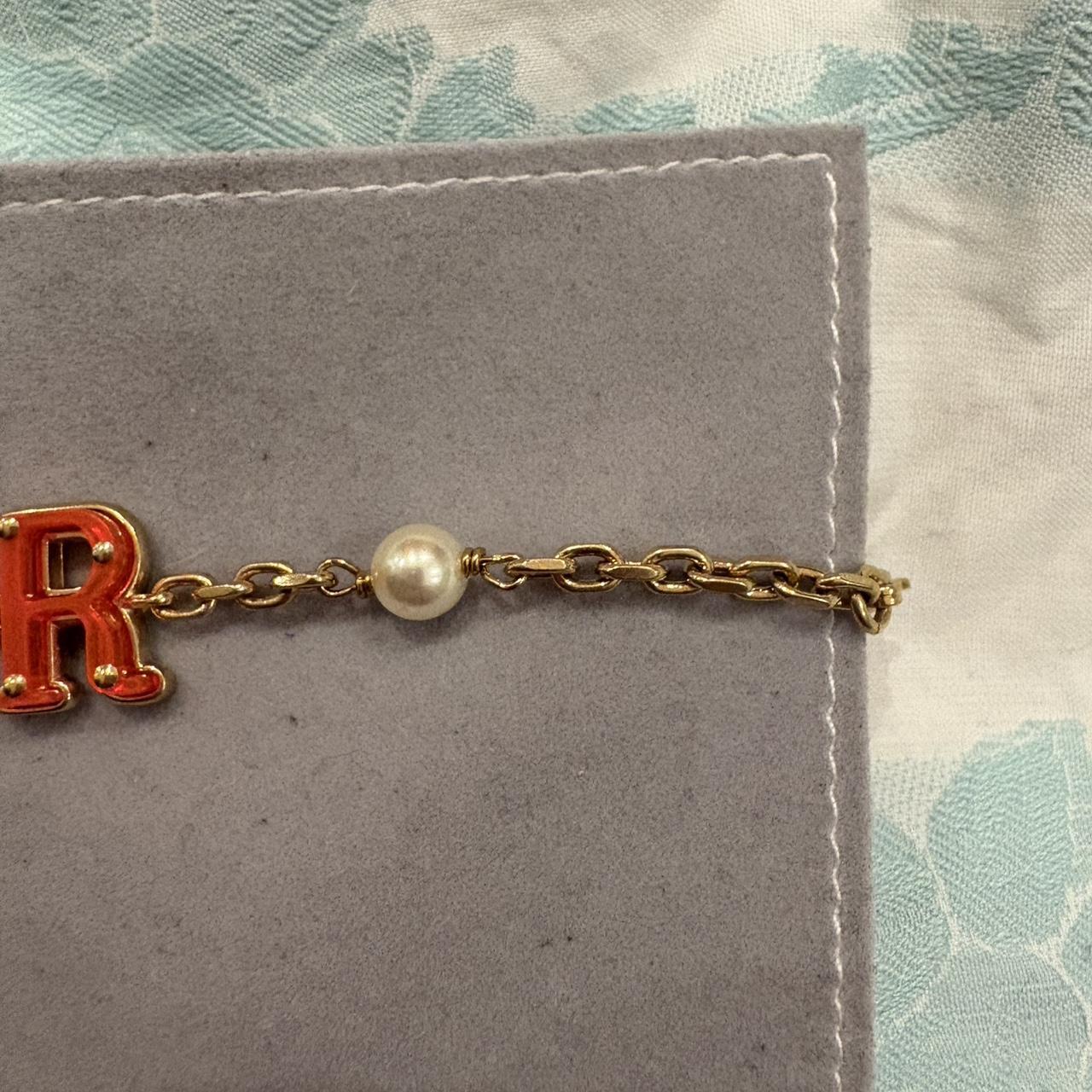 Dio r evolution Bracelet Gold-Finish Metal and White... | Depop