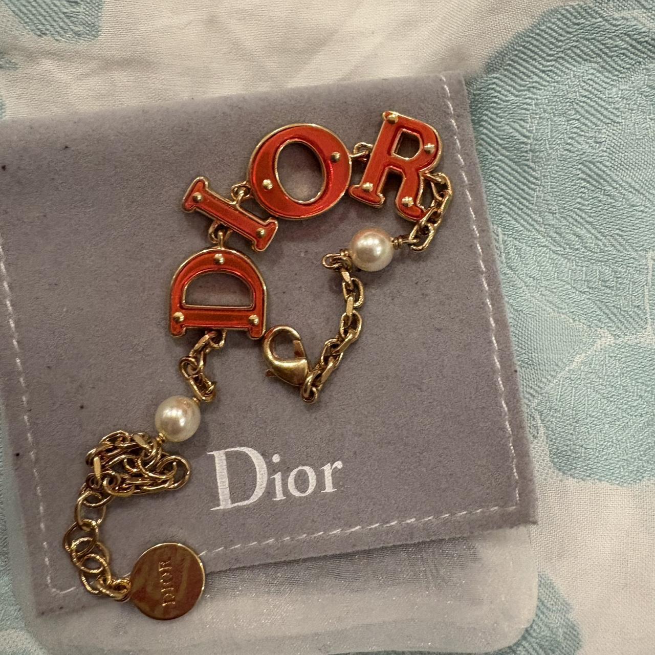 Dio r evolution Bracelet Gold-Finish Metal and White... | Depop