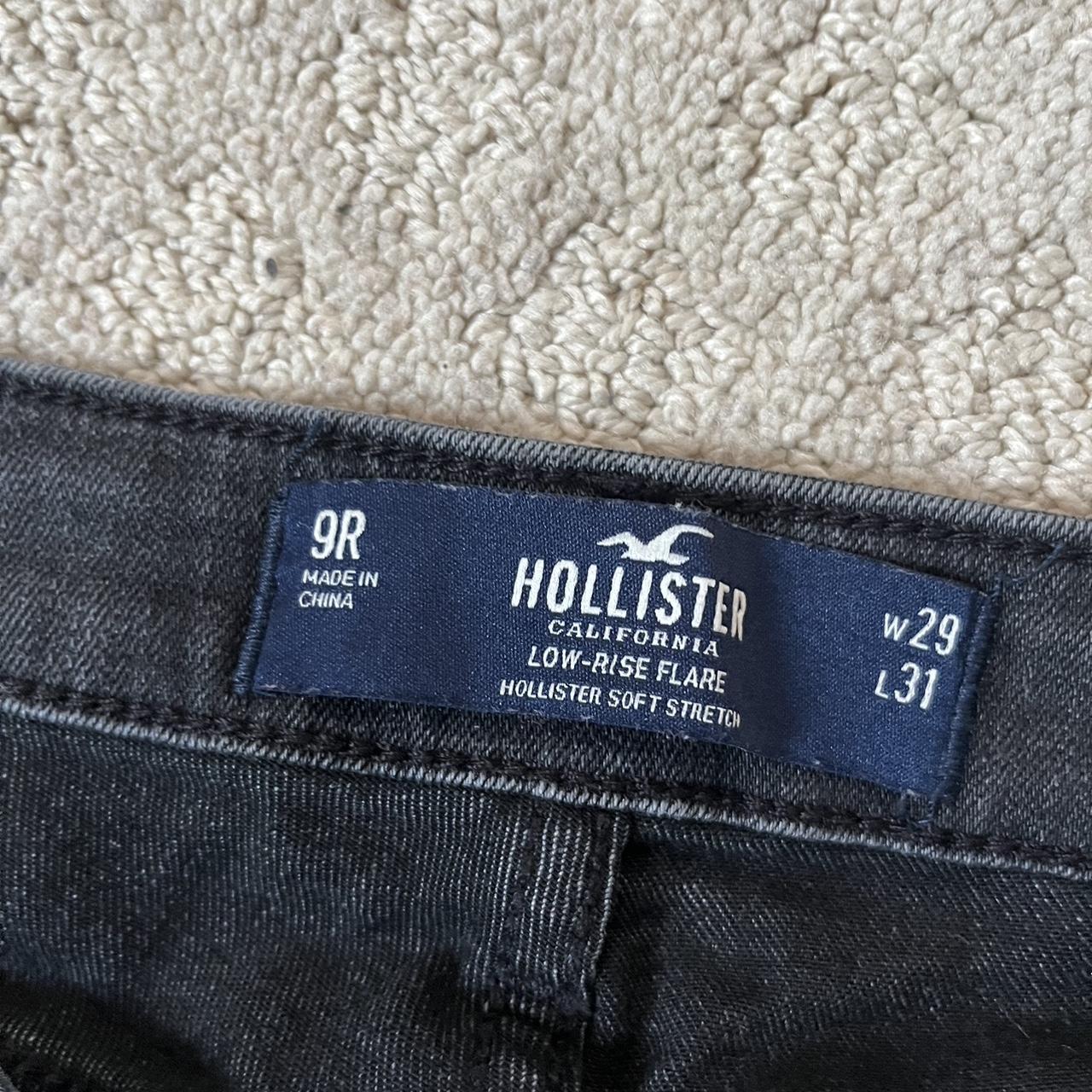 Washed out black low rise flare Hollister jeans size... - Depop