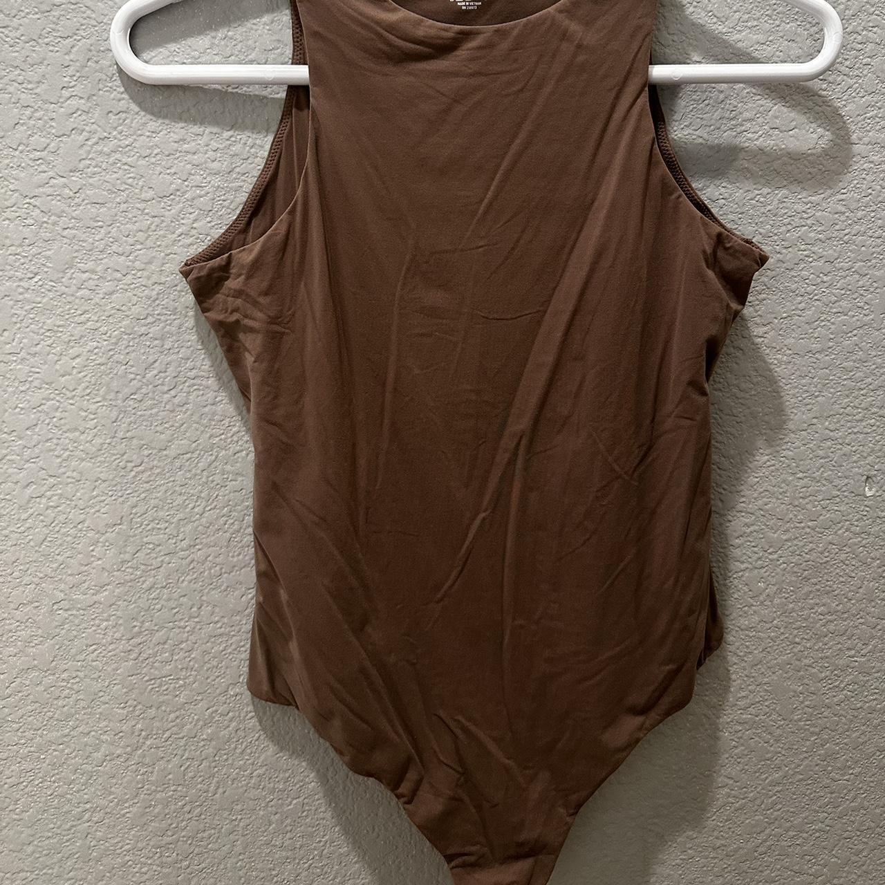 Skims dark tan body suit closed with buttons. High... - Depop