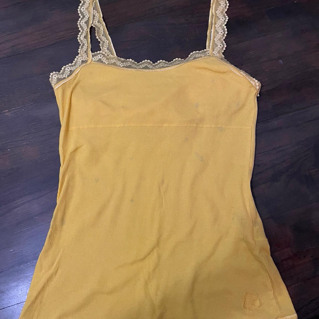 yellow lace tank top has a cute flower in the bottom... | Depop