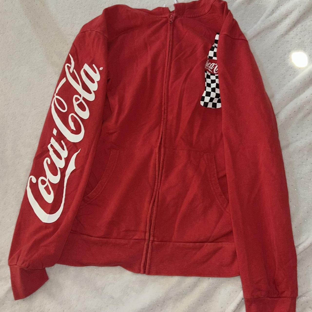 A well loved long sleeved red coca-cola jacket with... - Depop