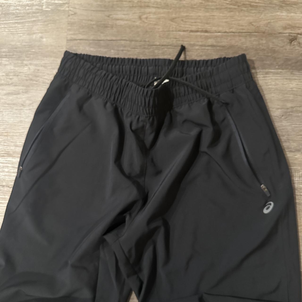 ASICS black track pants #runningessentials text... - Depop