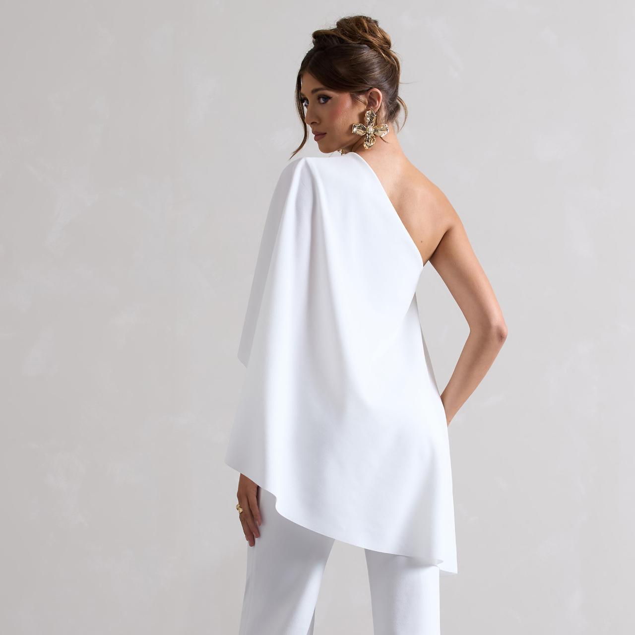 Pristine | White One Shoulder Cape Sleeve Flared-Leg... - Depop