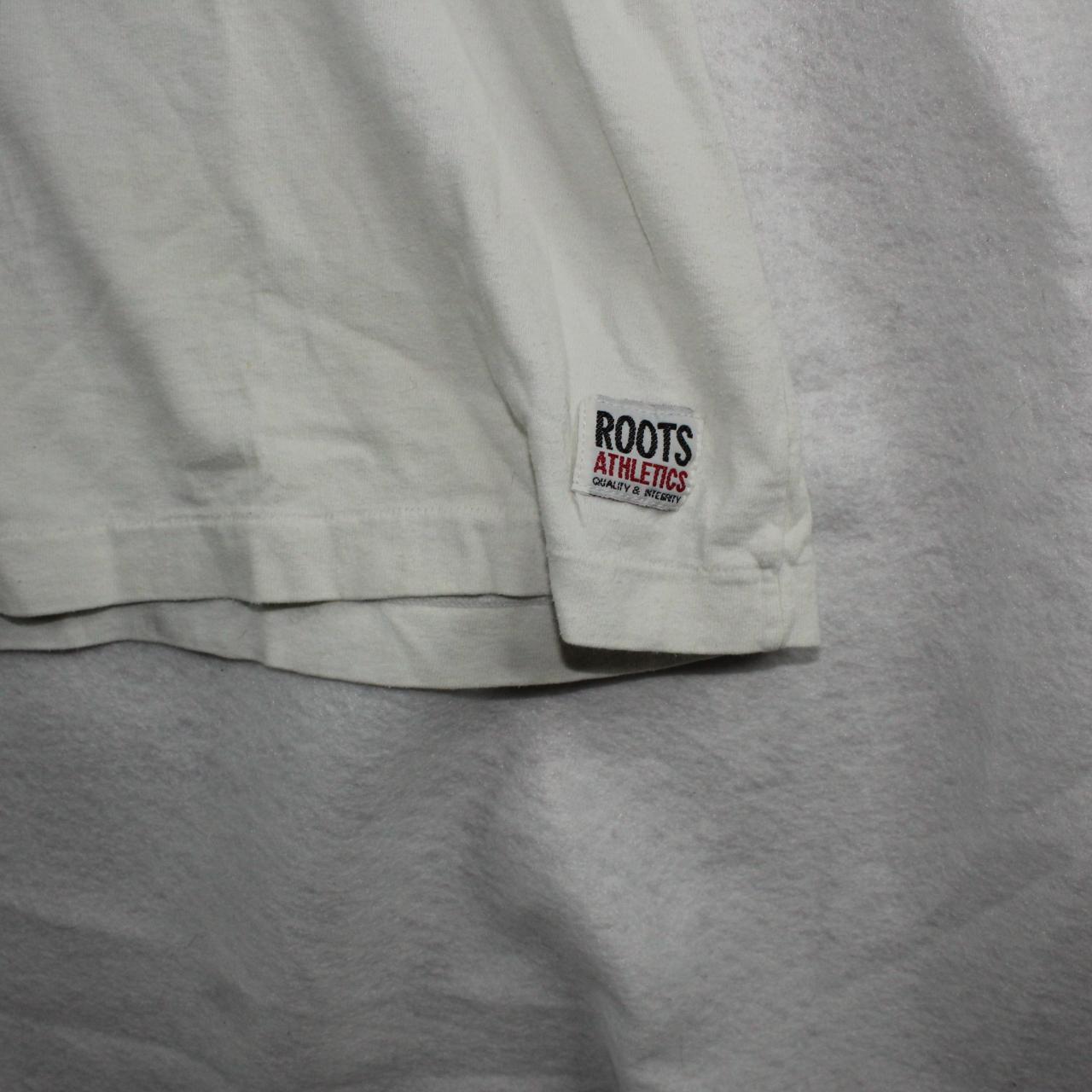 This is a vintage Roots Athletics T-Shirt made of... - Depop