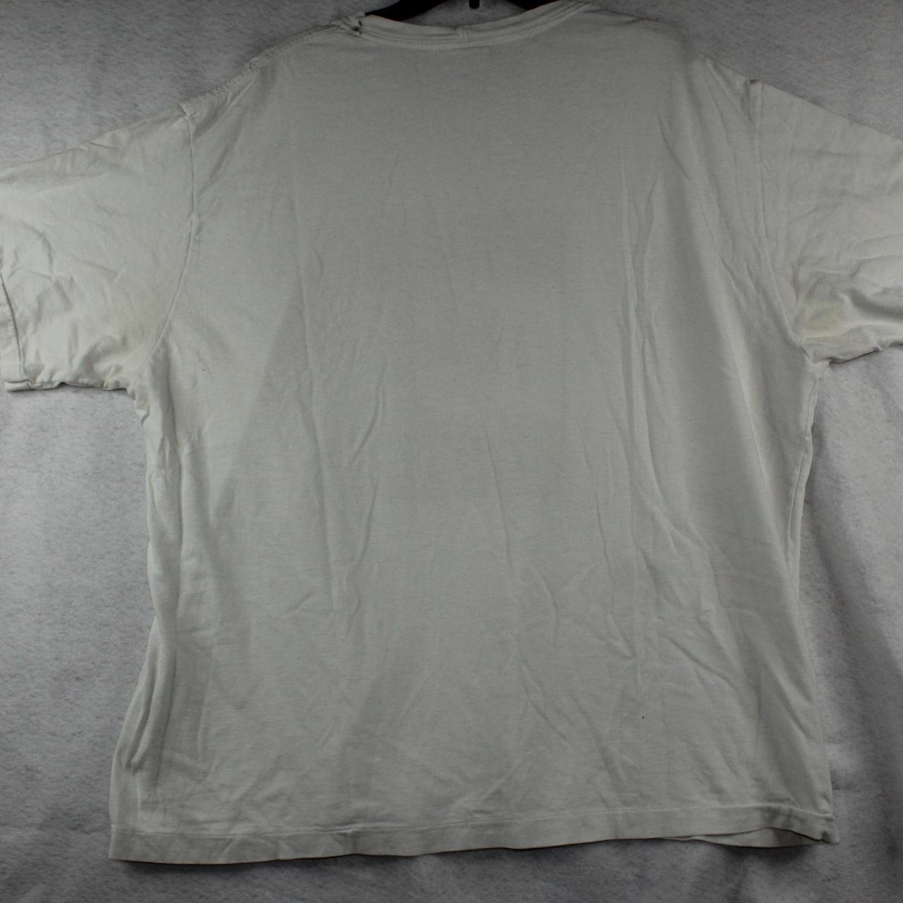 This is a vintage Roots Athletics T-Shirt made of... - Depop