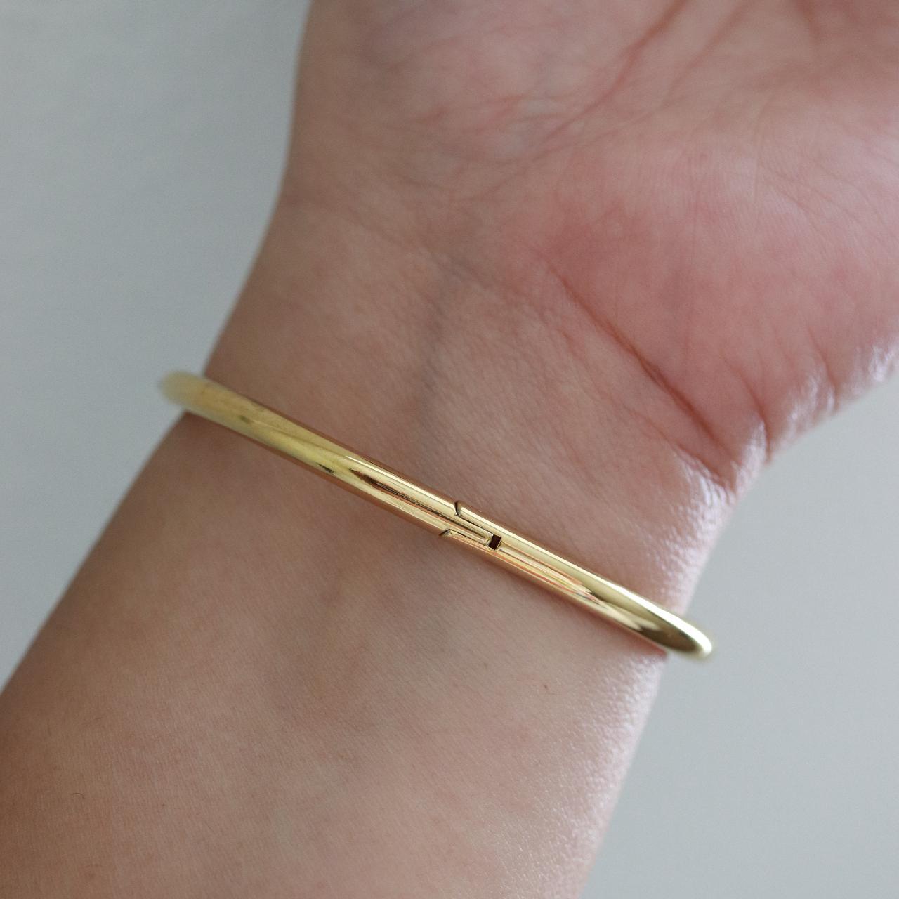 17cm Gold Plated Stainless Steel Lock Ring CZ Bangle... - Depop