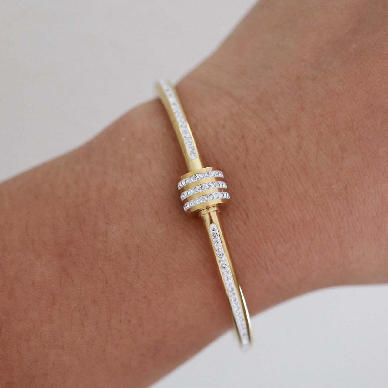 17cm Gold Plated Stainless Steel Lock Ring CZ Bangle... - Depop