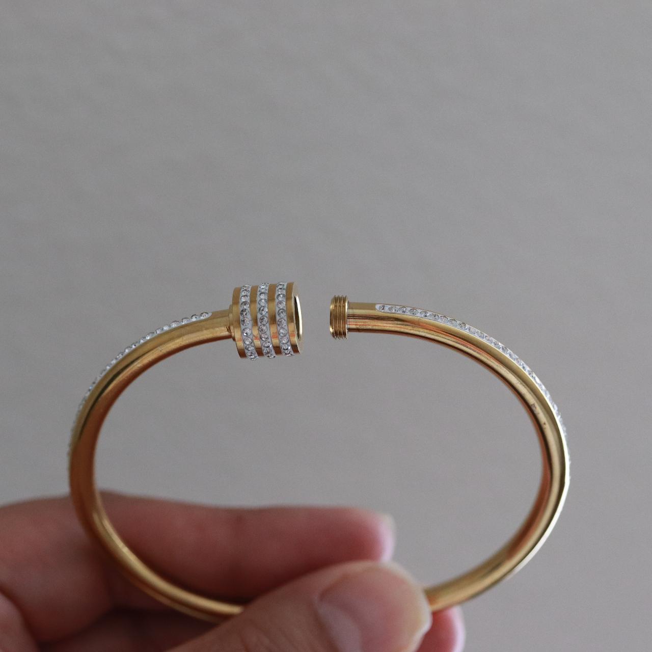 17cm Gold Plated Stainless Steel Lock Ring CZ Bangle... - Depop