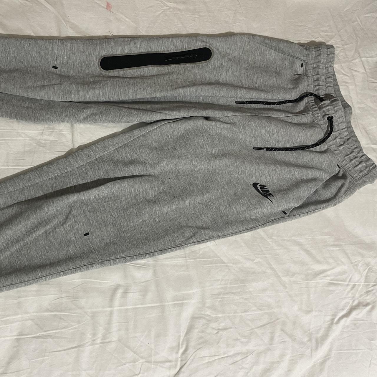 Grey Nike tech fleece pants - Depop