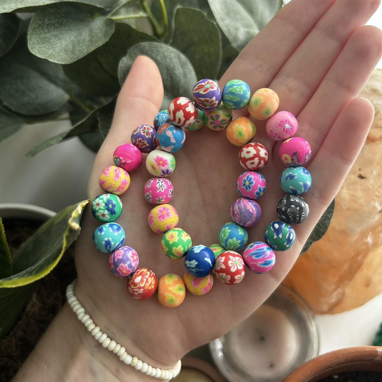 Multi colored hippie beaded bracelet with designs on... - Depop