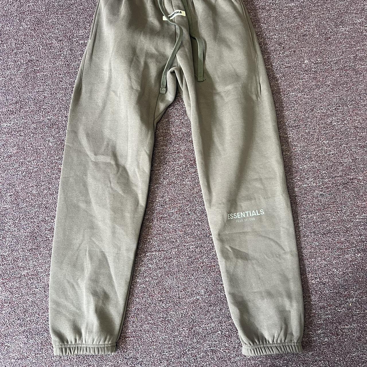Medium army green essentials sweatpants, fits baggy... - Depop