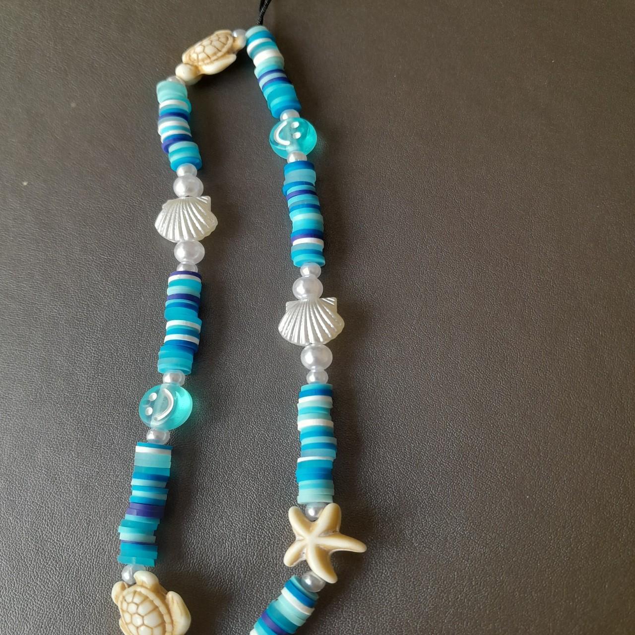 Blue clay bead phone charm - Depop