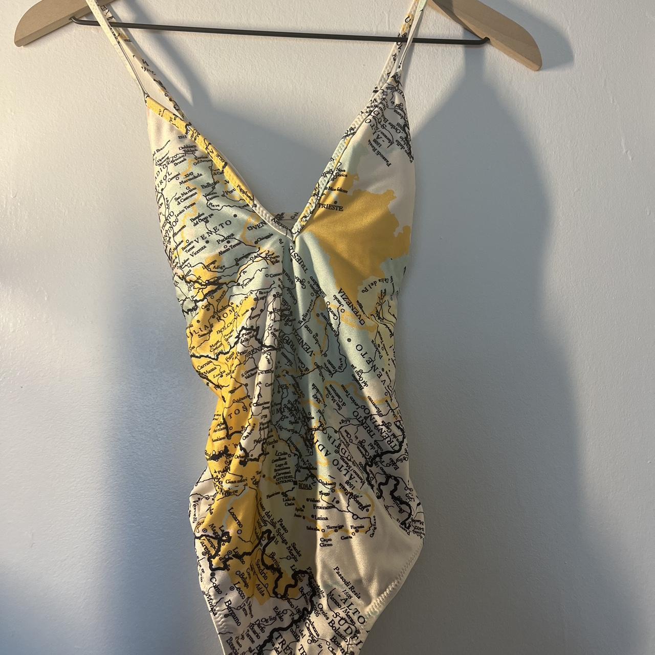 Cute, form-fitting one piece. Worn only once. Has a... - Depop