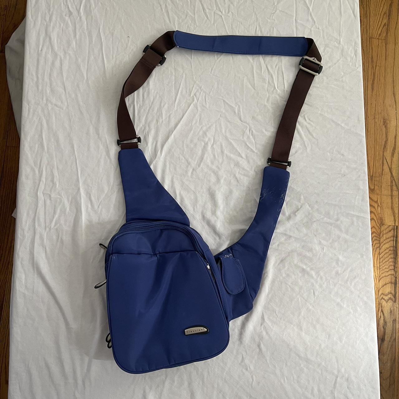 Travelon Blue Crossbody Backpack Has some white... - Depop