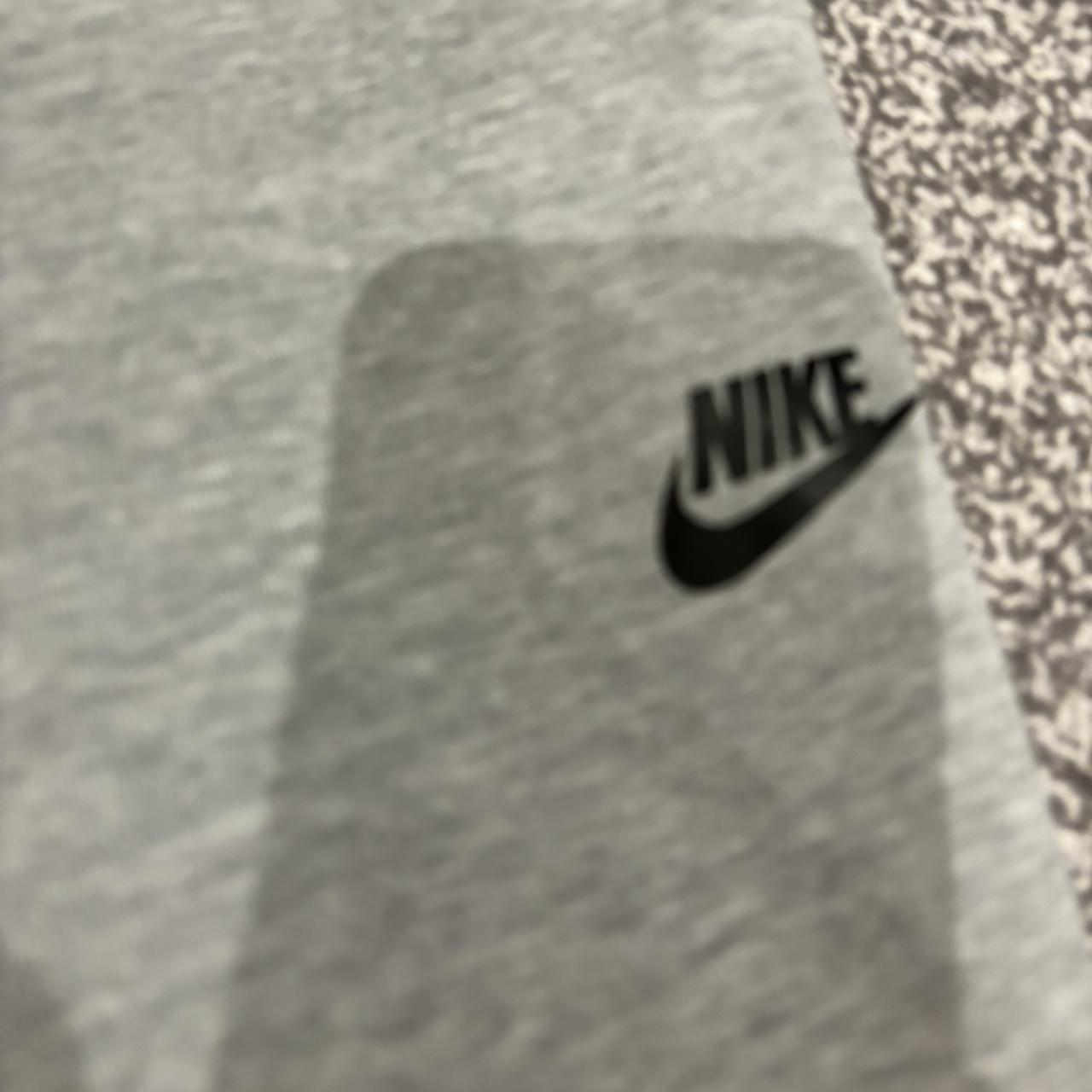 Grey Nike tech, no imperfections other than cut out... - Depop