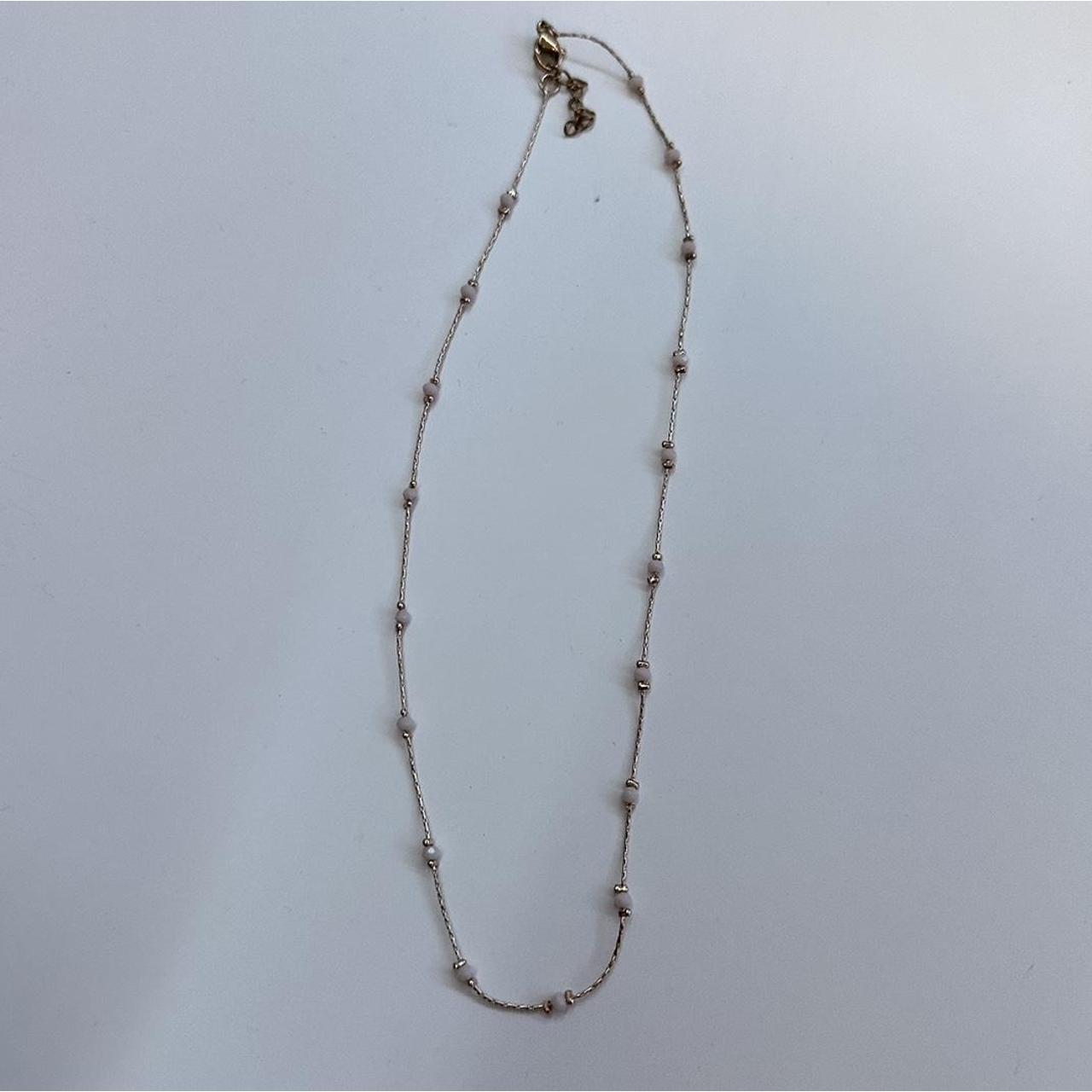- Brandy Melville gold necklace w/ white beads -... - Depop