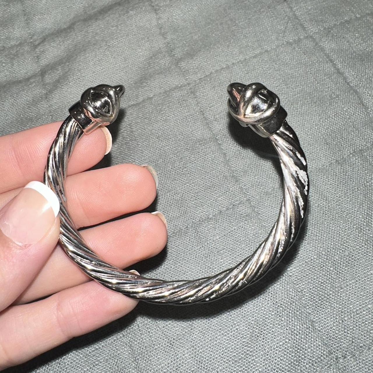chunky silver twisted bangle with x decorations on... - Depop